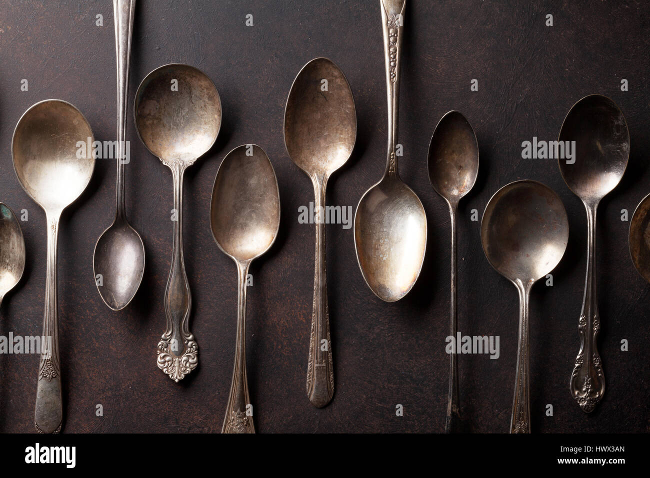 Old vintage spoons on stone table. Top view Stock Photo - Alamy