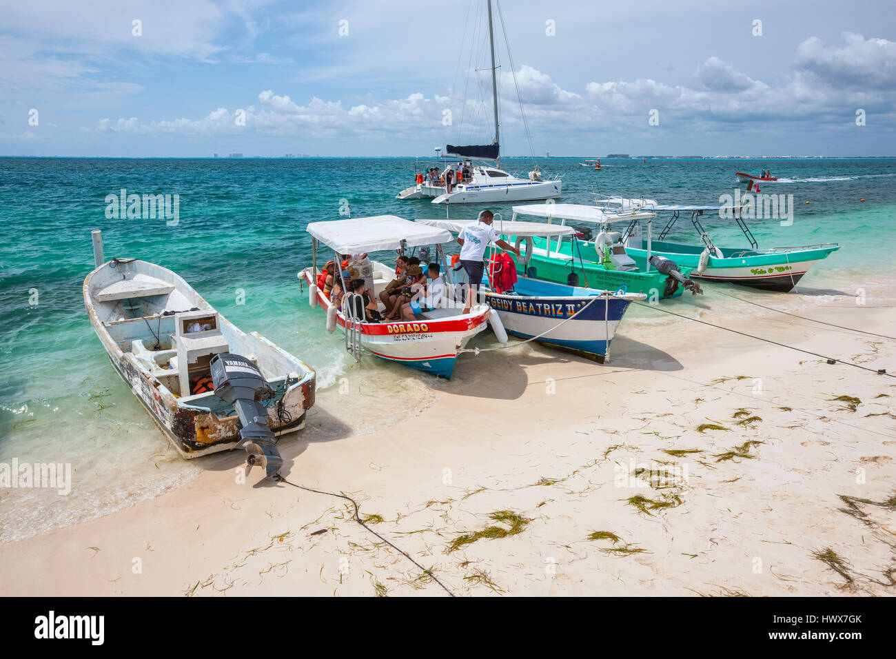 Fishing boats on the sand beach on Isla Mujeres in Mexico Stock Photo ...