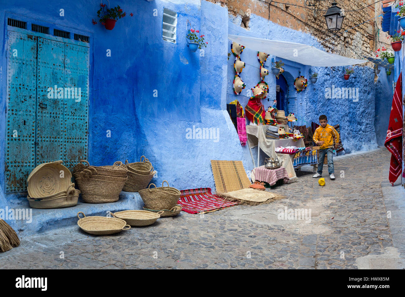 Chefchaouen, Morocco. Street Scene: Straw Hats and Baskets for Sale ...