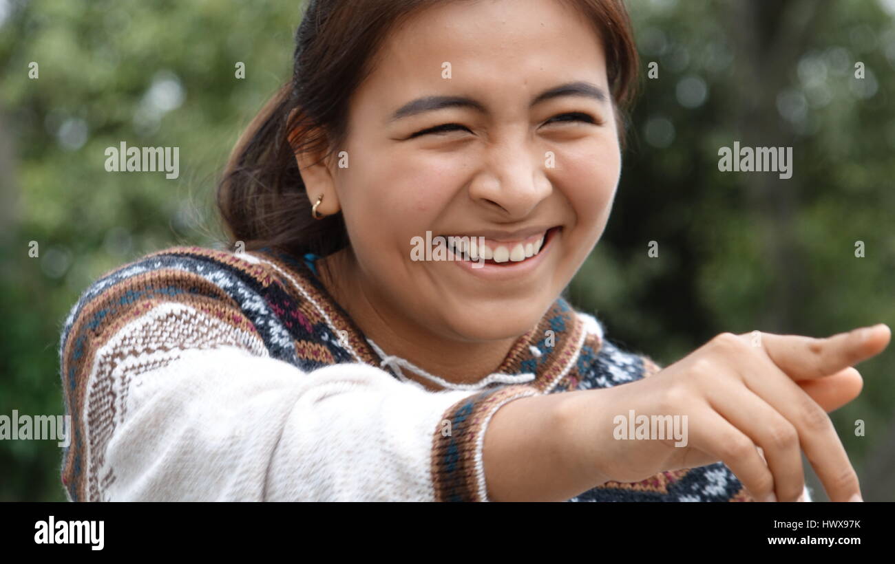 Happy Peruvian Teen Girl Pointing Stock Photo - Alamy