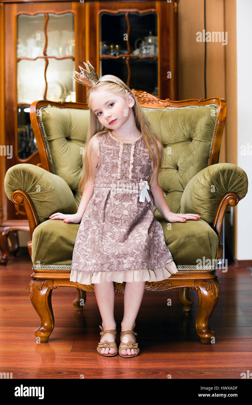 Little princess on a chair Stock Photo - Alamy
