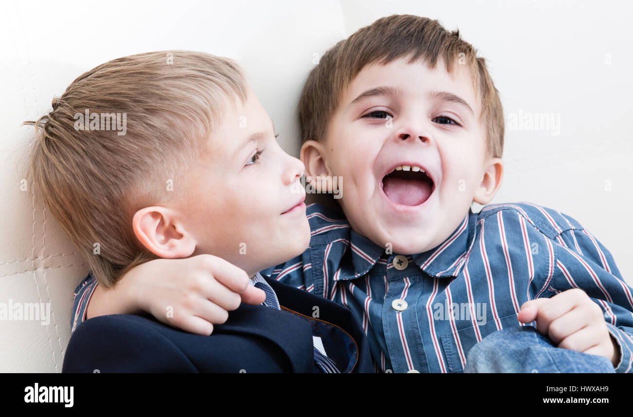 Two brothers play, one of them joyfully shouts Stock Photo - Alamy