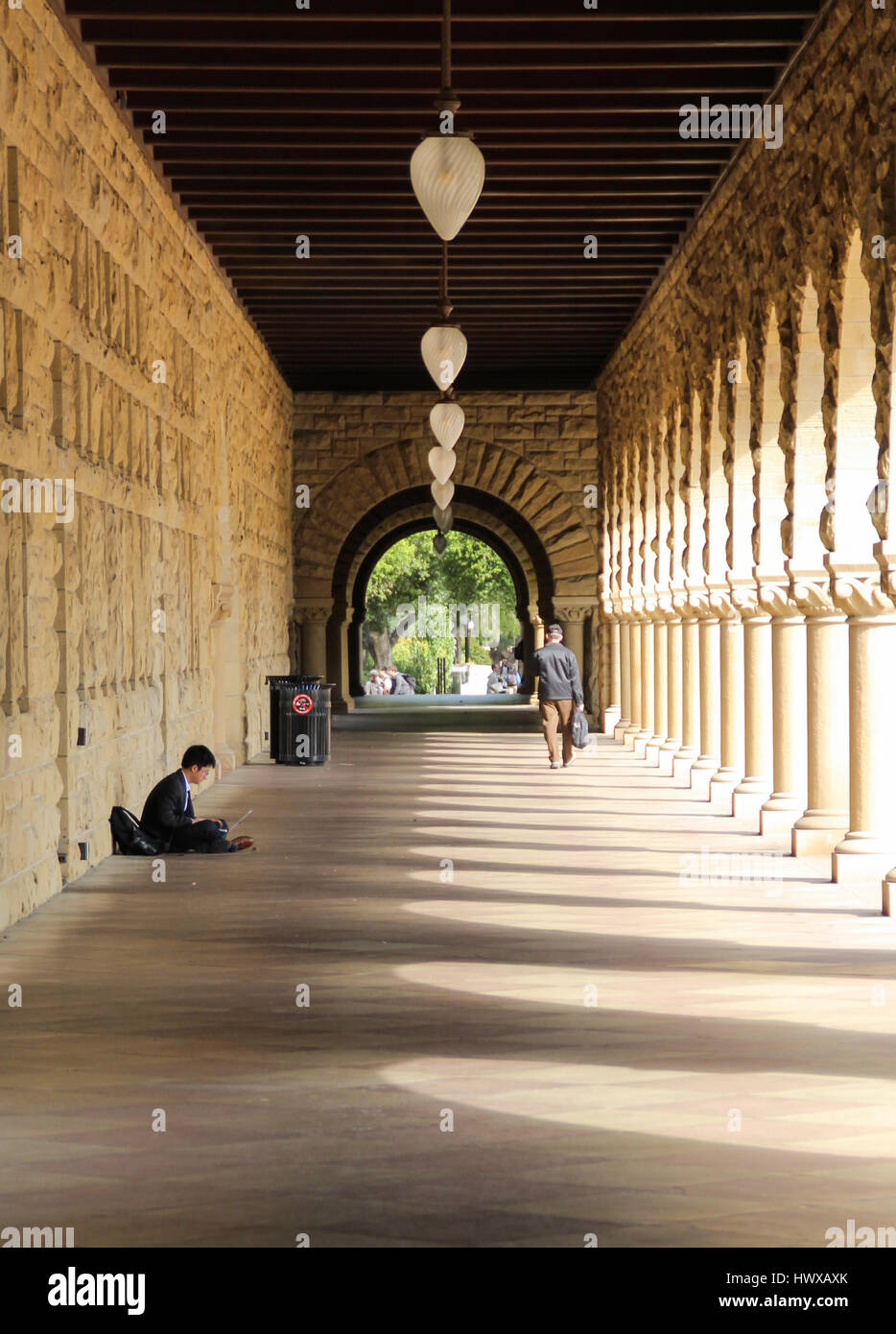 pattern of arches with lights through pillars Stock Photo - Alamy