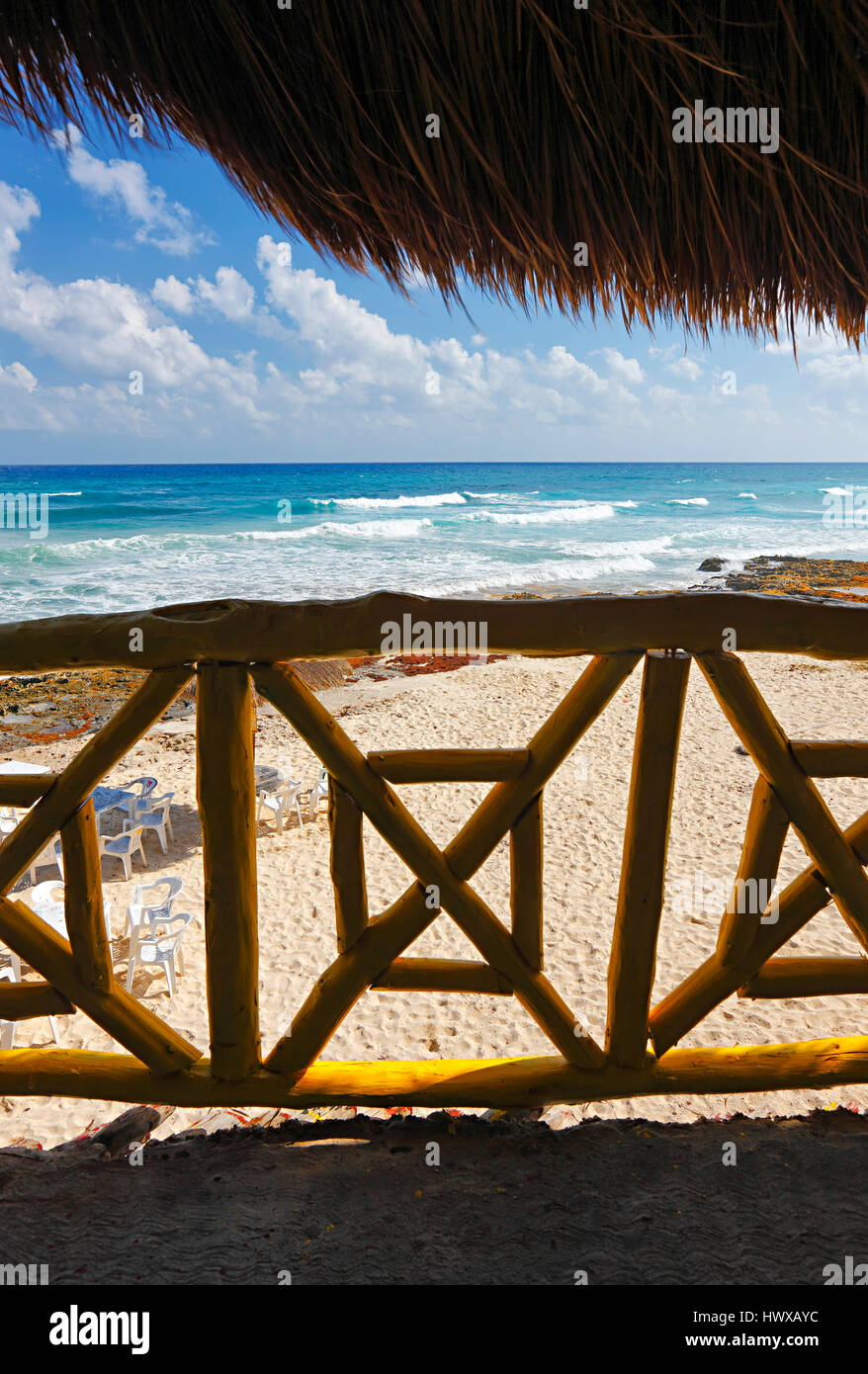 View to sand beach from Mexican straw roof house Stock Photo - Alamy