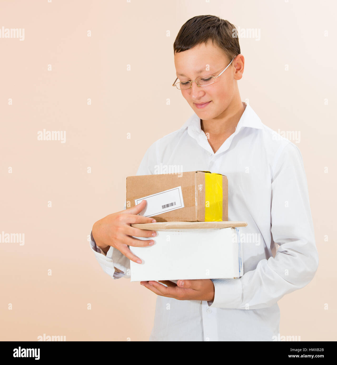 guy with boxes of parcels in the hands Stock Photo - Alamy