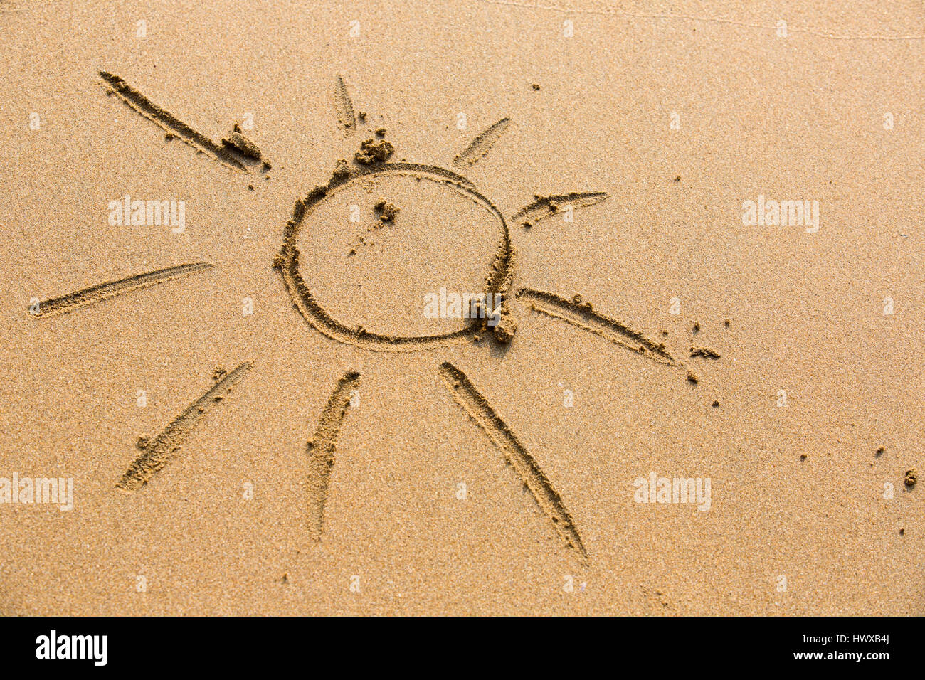 Sun drawn in the sand hi-res stock photography and images - Alamy