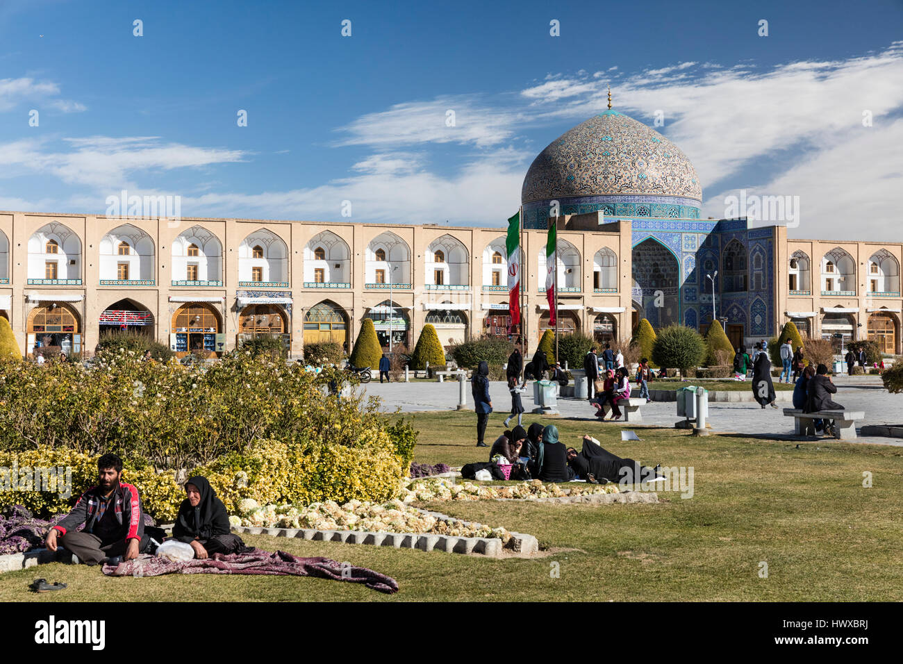 Imam Square in Isfahan with visitors, including picnickers, chador-clad ...