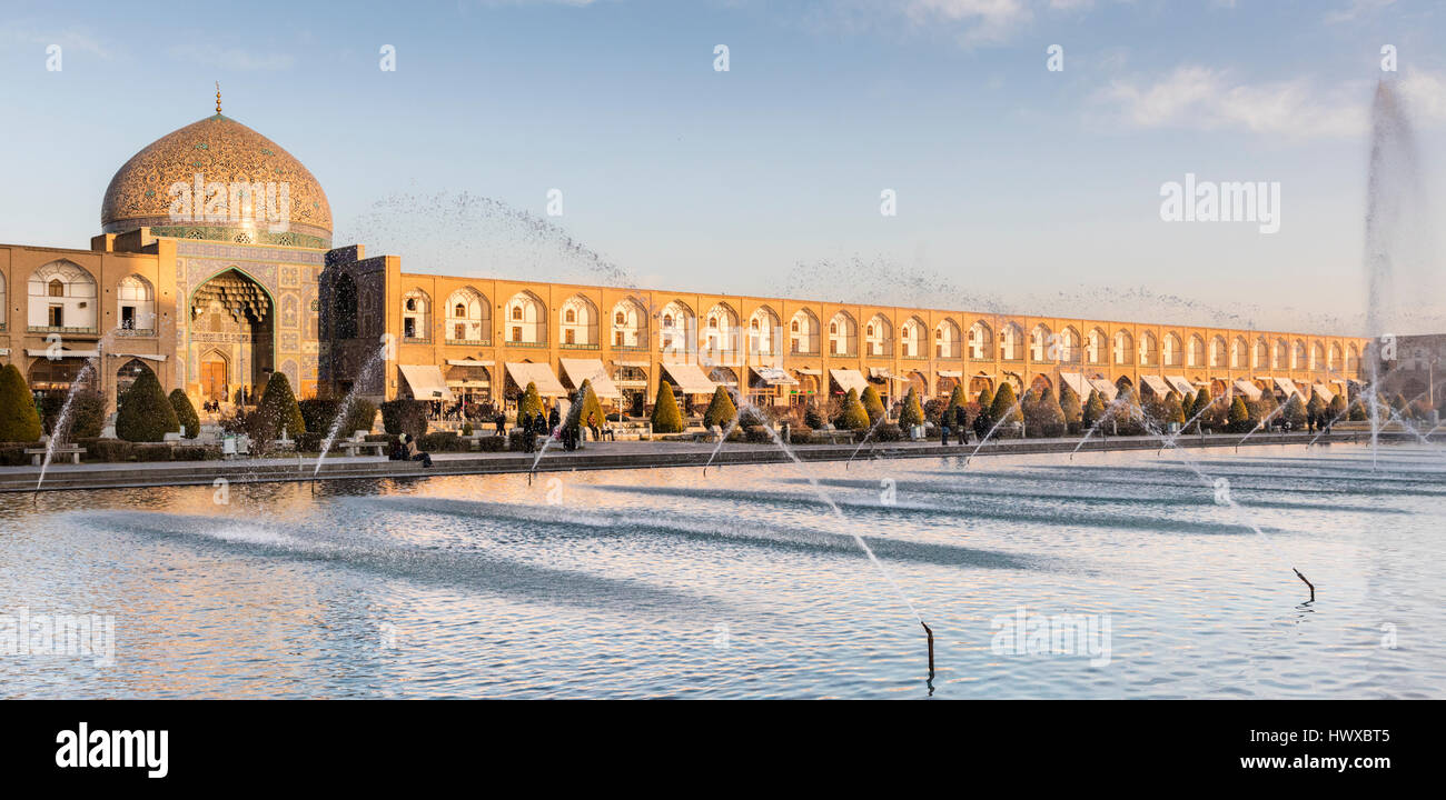 Imam Square in Isfahan with visitors,decorative fountains, and dome of ...
