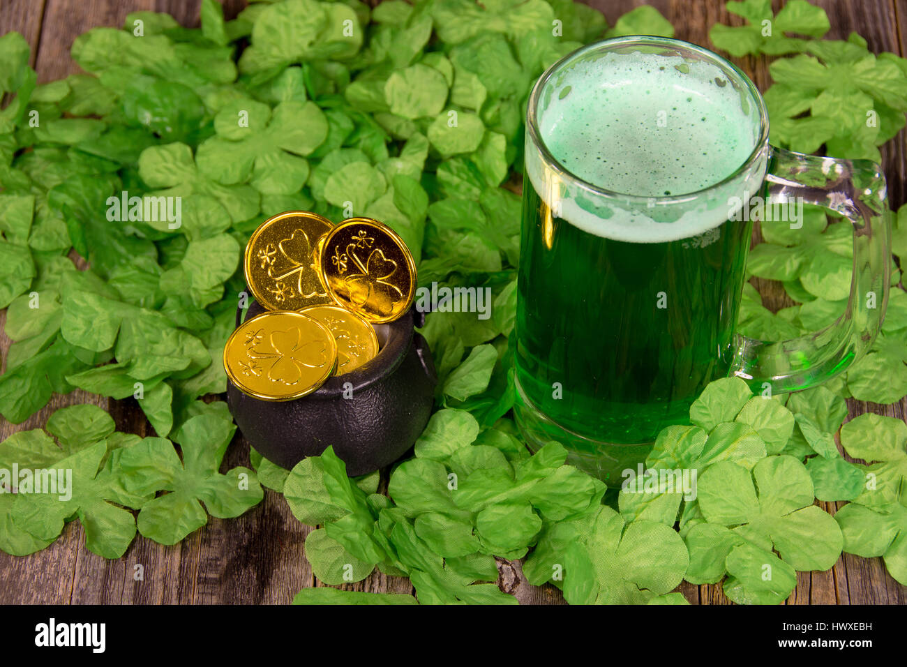 green beer with gold coins in Irish shamrocks Stock Photo - Alamy