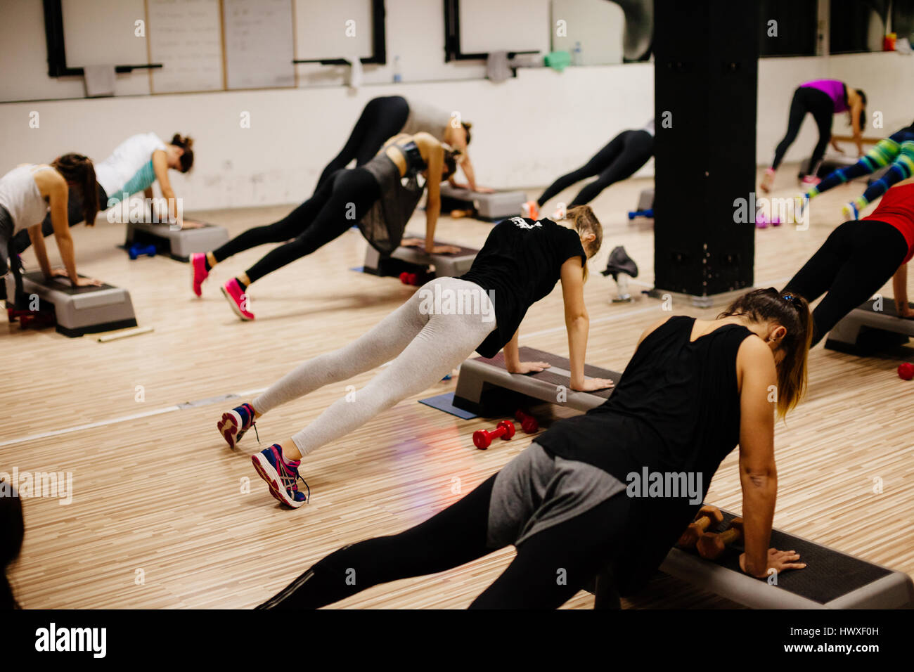Woman Stretching group. women fitness class indoors Stock Photo - Alamy