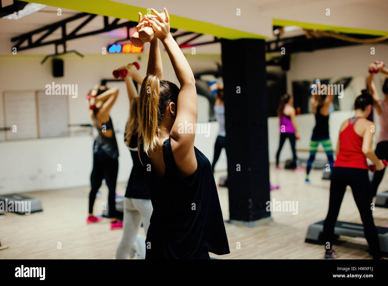 Woman Stretching group. women fitness class indoors Stock Photo - Alamy
