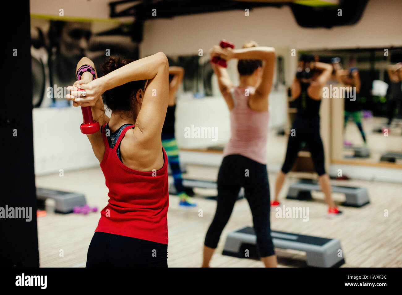Woman Stretching group. women fitness class indoors Stock Photo - Alamy