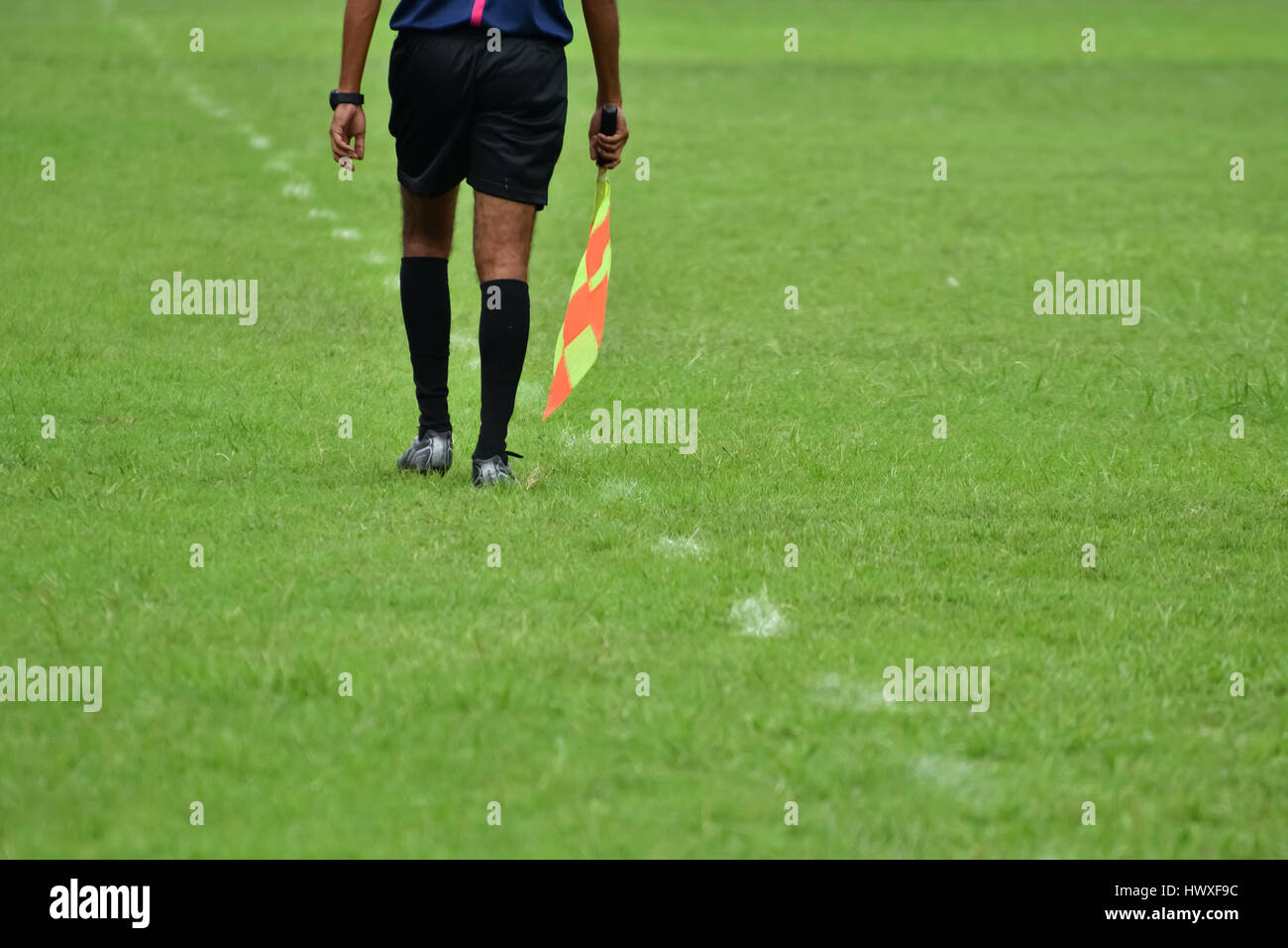 Assistant referee running along the sideline Stock Photo - Alamy