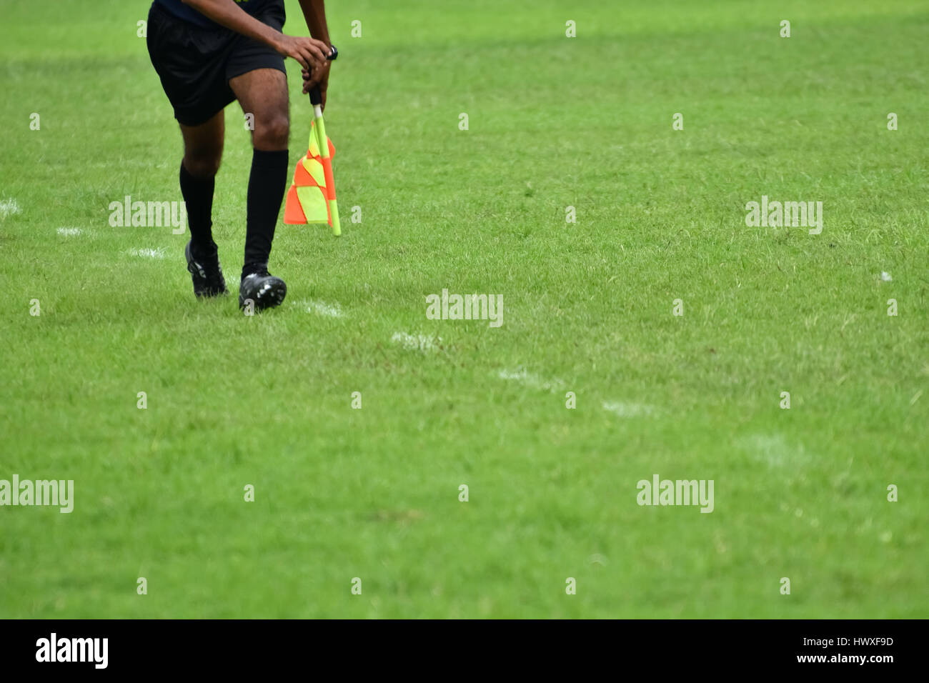 Assistant referee running along the sideline Stock Photo - Alamy