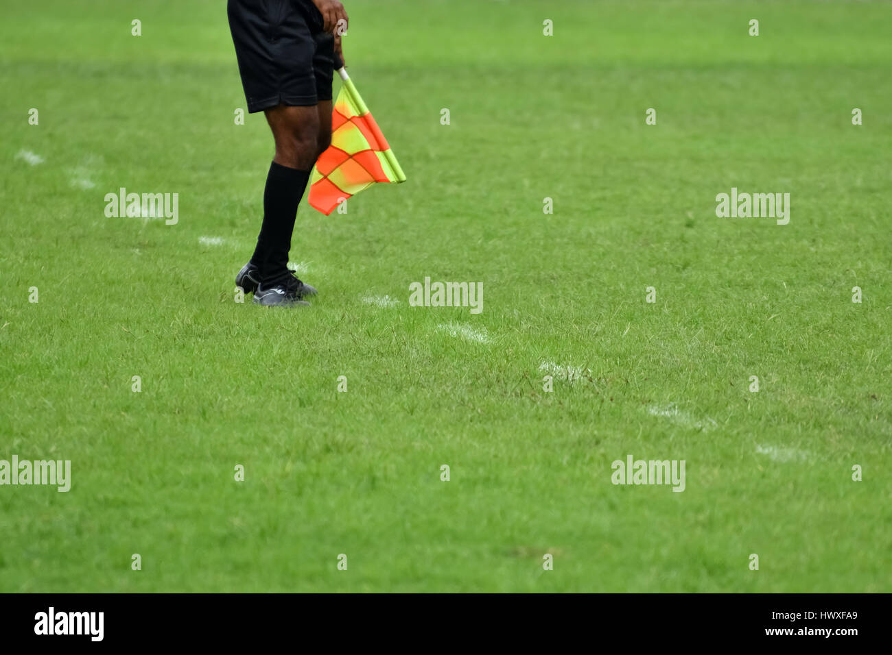 Assistant referee running along the sideline Stock Photo - Alamy