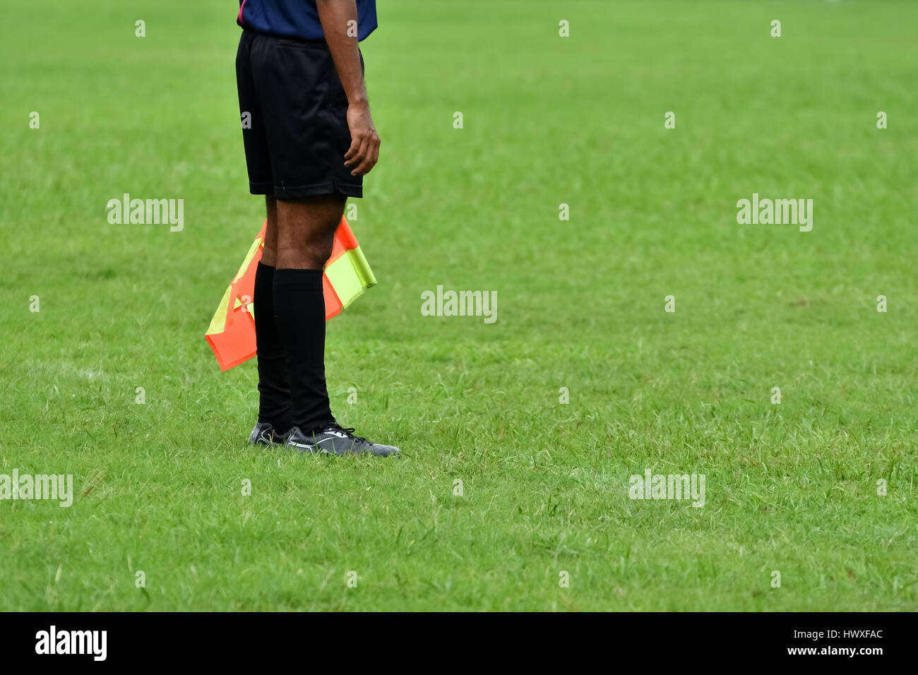 Assistant referee running along the sideline Stock Photo - Alamy