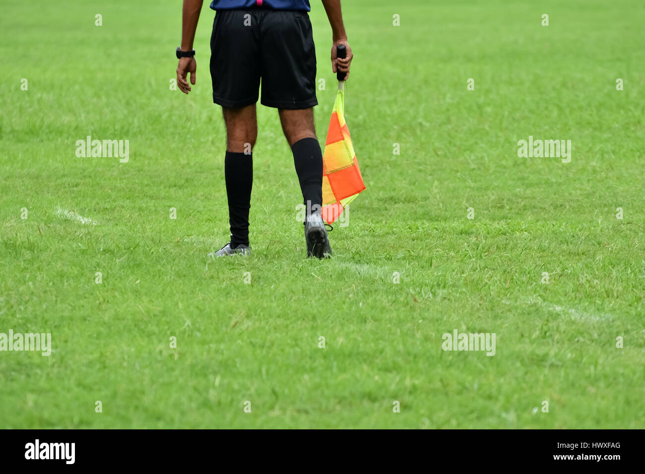 Assistant referee running along the sideline Stock Photo - Alamy