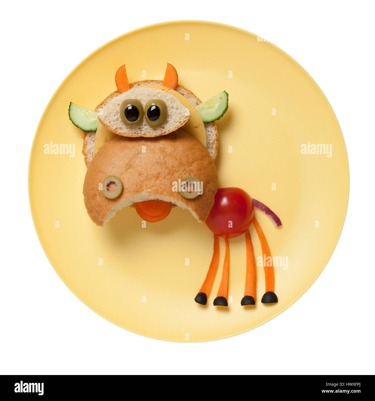 Cow created from bread and vegetables on plate Stock Photo - Alamy