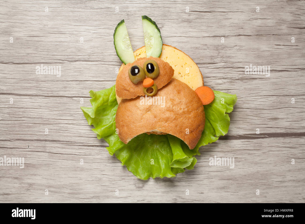 Scared sandwich rabbit created on wooden table Stock Photo - Alamy