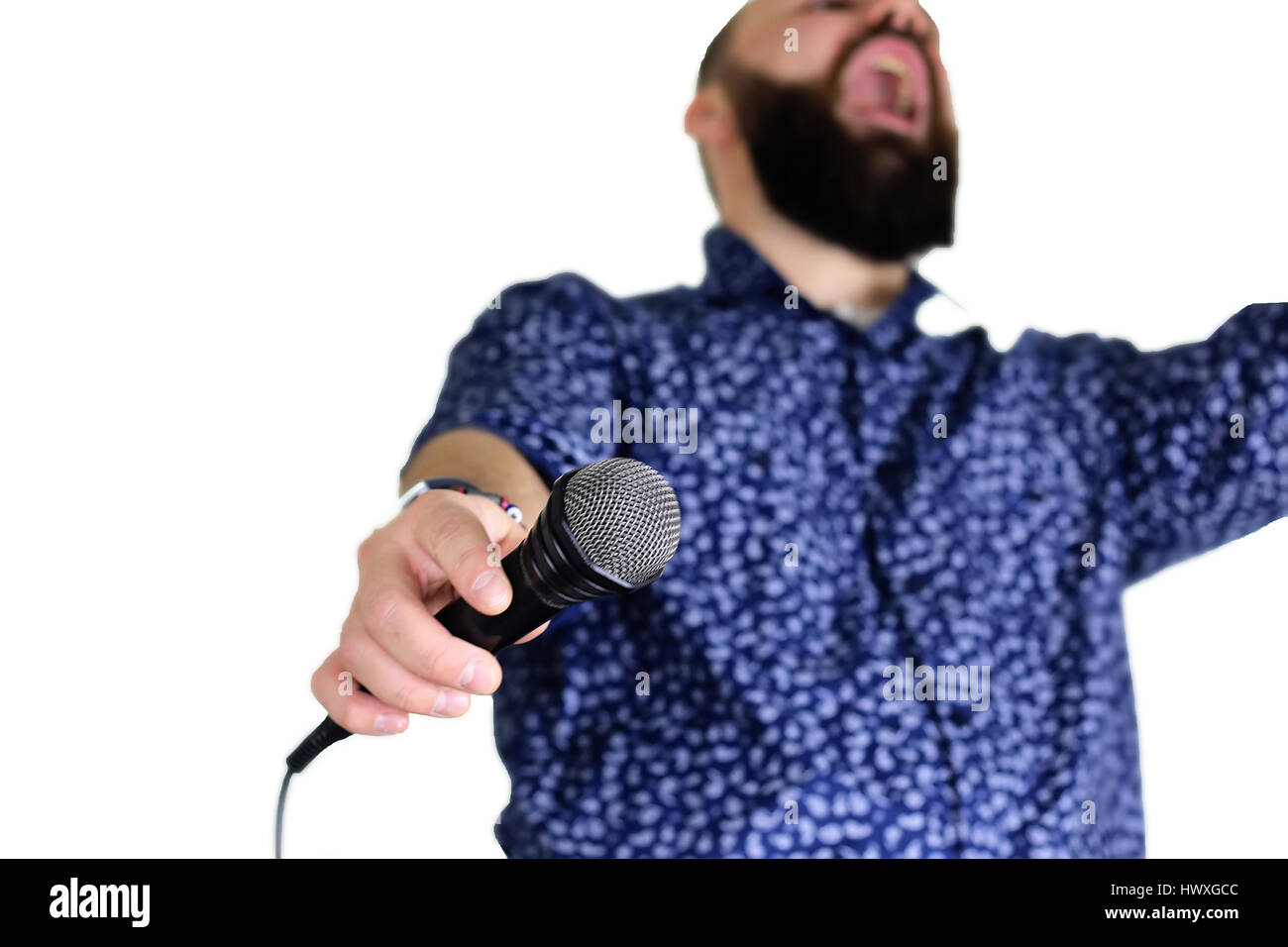 microphone on stage hand hold Stock Photo - Alamy