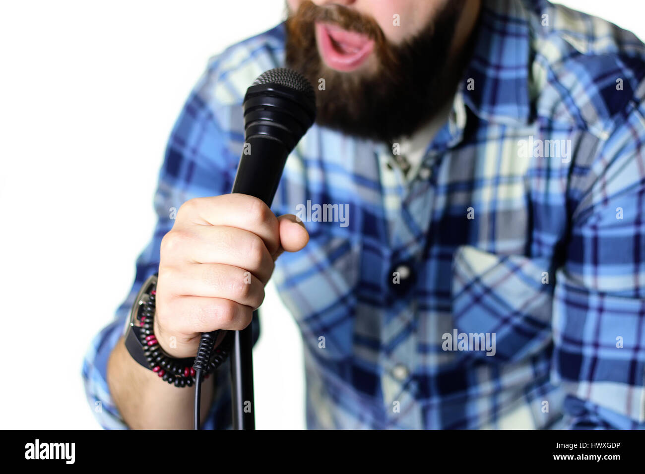 microphone on stage hand hold Stock Photo - Alamy