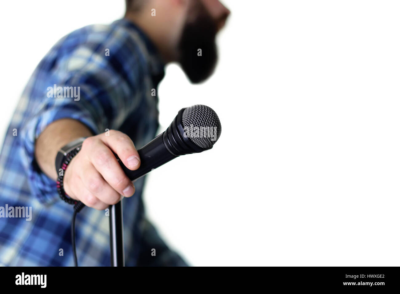 microphone on stage hand hold Stock Photo - Alamy