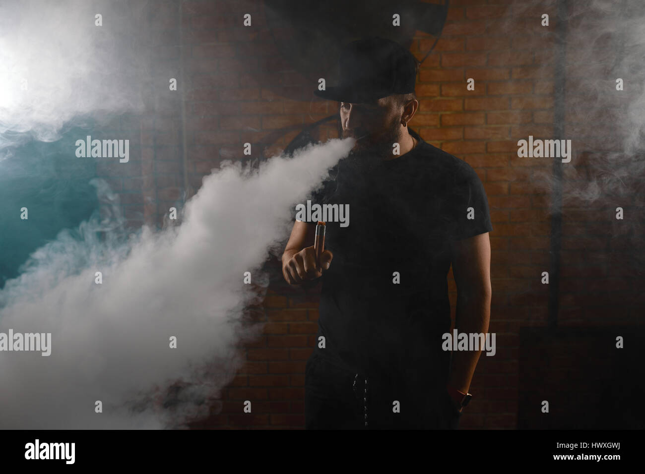 Man vaping an electronic cigarette Stock Photo - Alamy