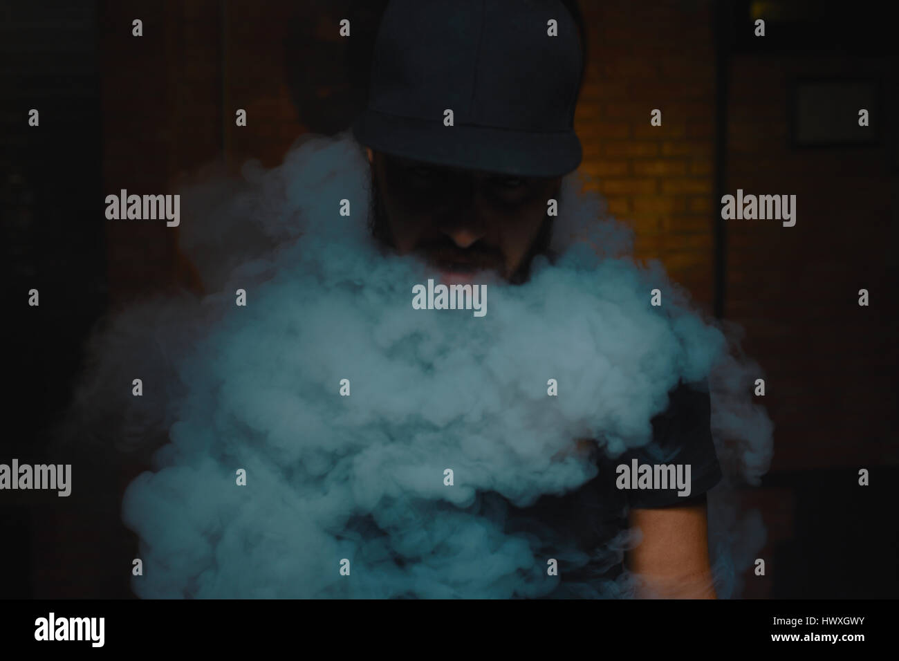 Man vaping an electronic cigarette Stock Photo - Alamy