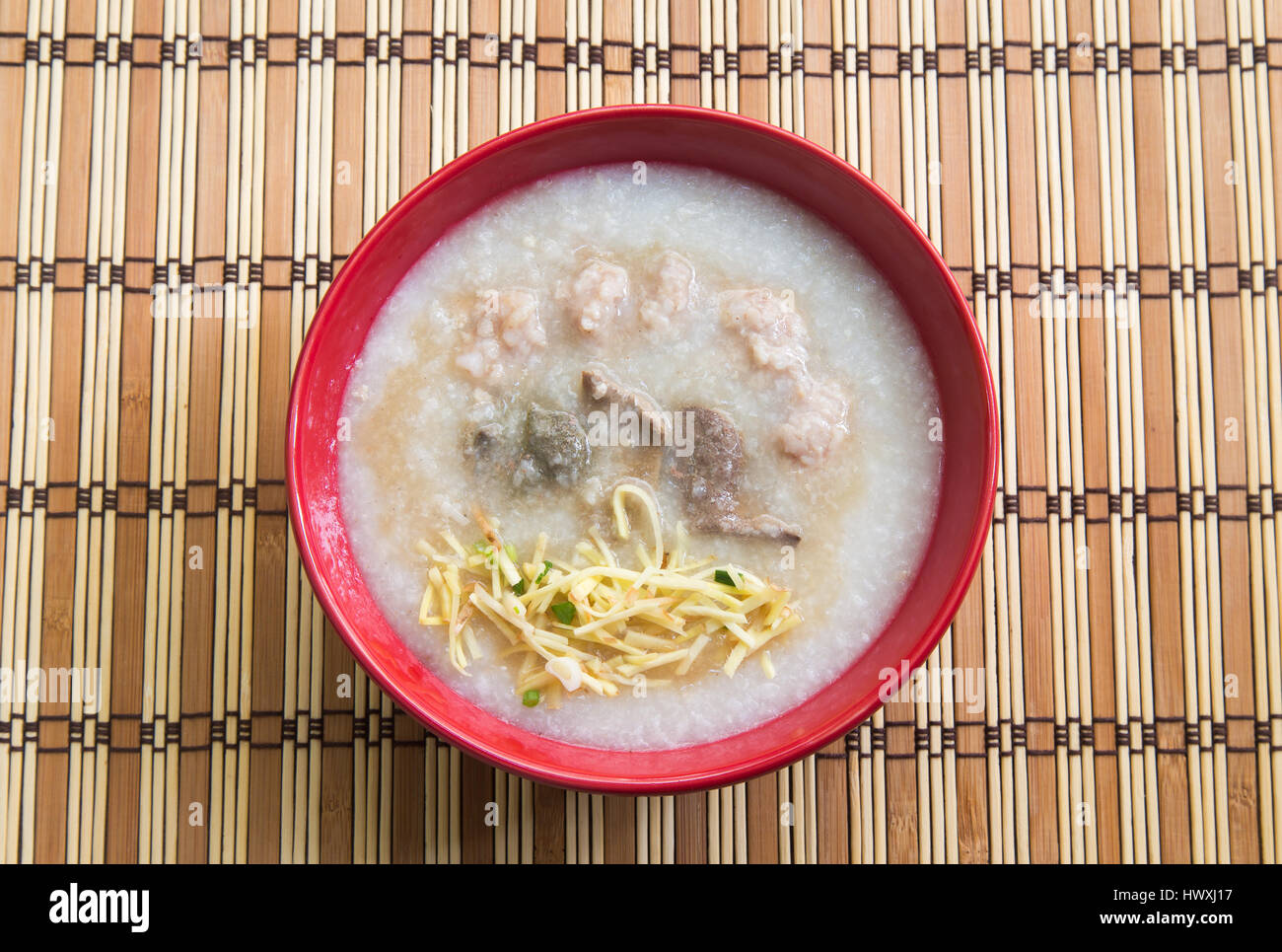 Congee, Rice porridge, Rice gruel, Rice soup on wooden background, Top ...