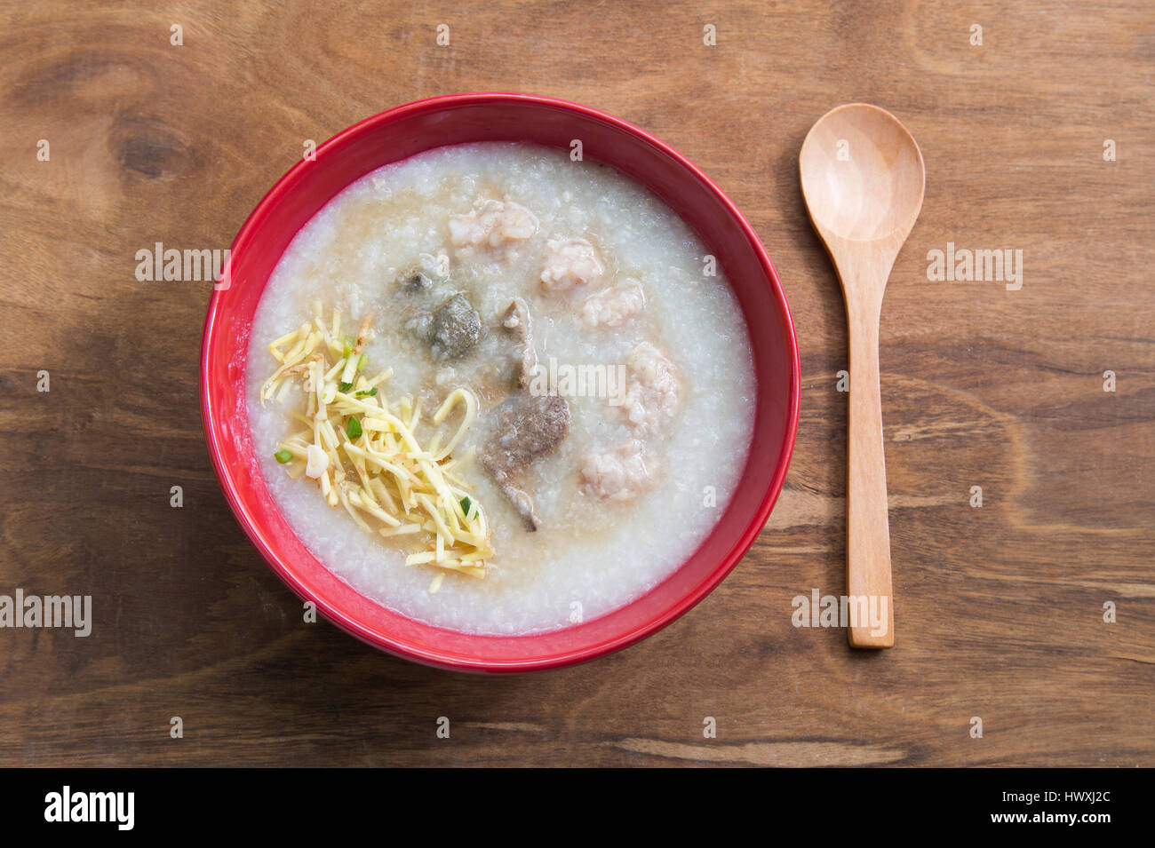 Congee, Rice porridge, Rice gruel, Rice soup on wooden background, Top ...