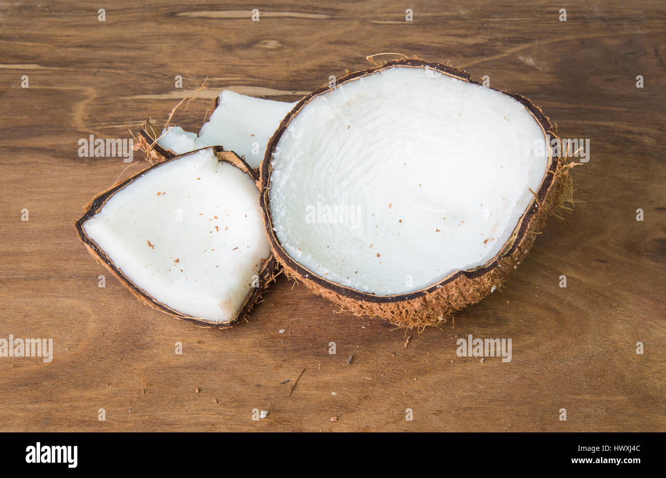 Coconut cut on wooden background Stock Photo - Alamy