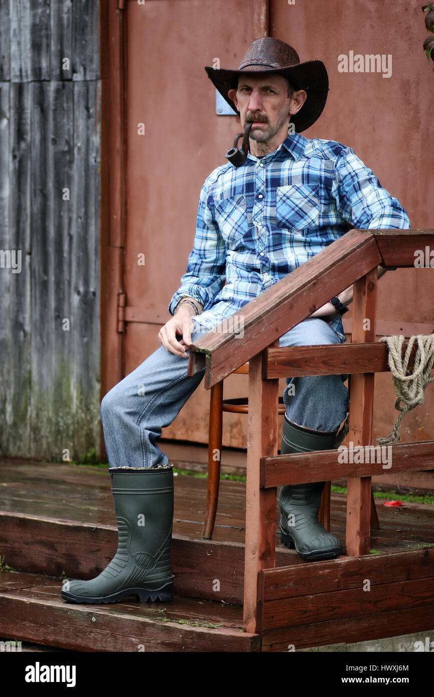 cowboy man smoke pipe Stock Photo - Alamy