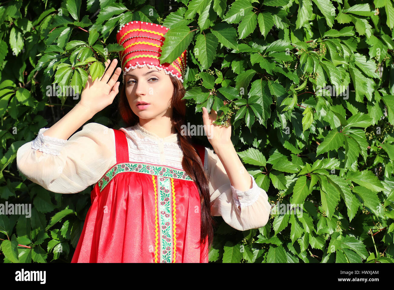 Slav in traditional dress ivy wall tree Stock Photo - Alamy