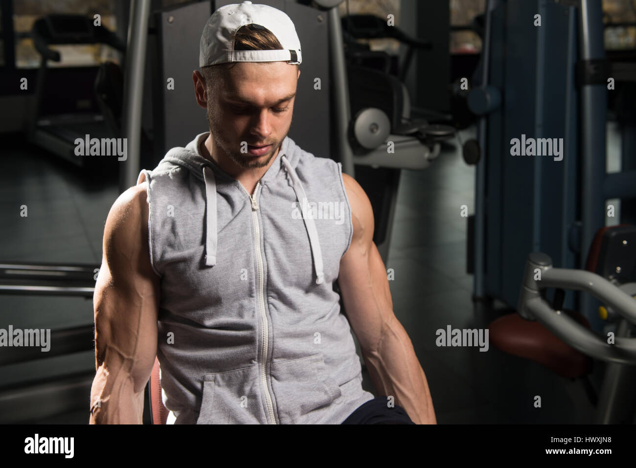 Leg Exercises Close Up - Man Doing Leg With Machine In Gym Stock Photo ...