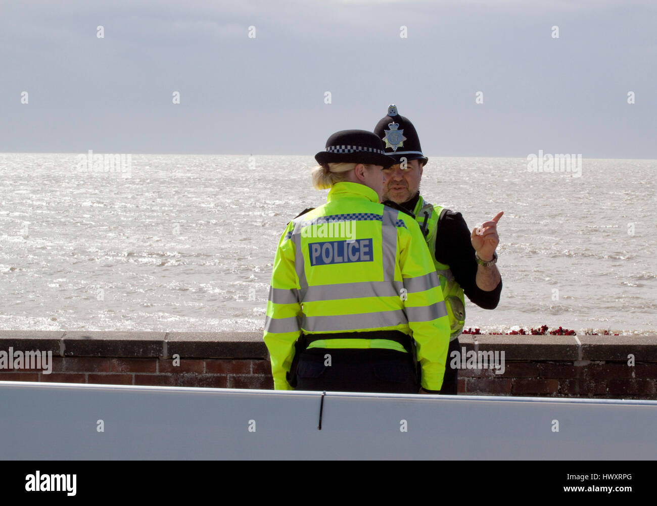 Two police officers patrolling on Felixstowe's sea front Stock Photo ...