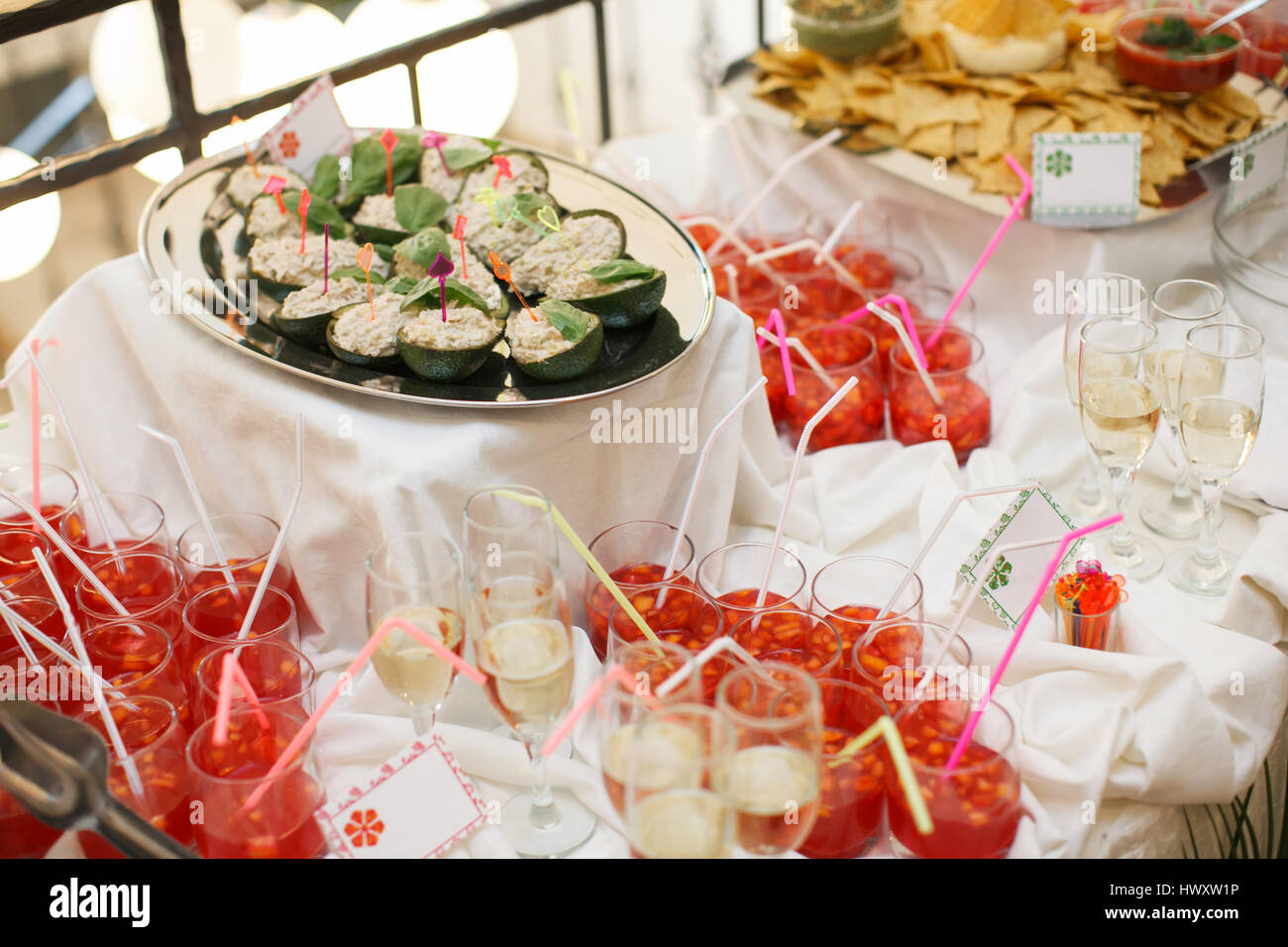 glasses with champagne. catering banquet table. a lot of snacks and ...