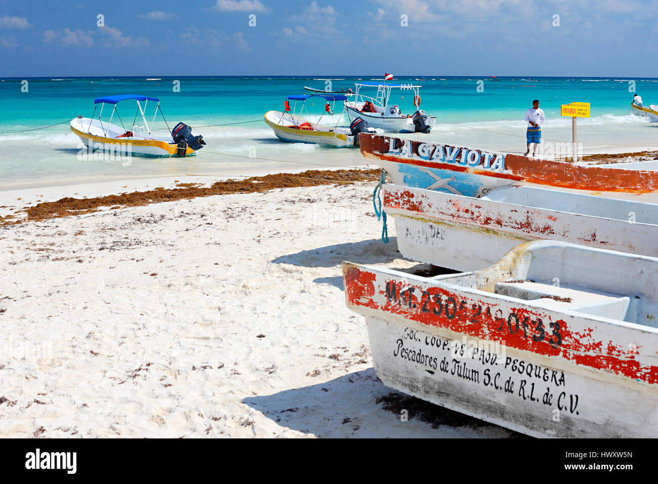 Traditional fishing boats on the sand beach in Mexico, Tulum Stock ...