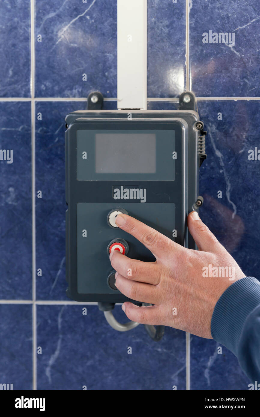 hand pressing keys on the control unit for sliding doors Stock Photo ...