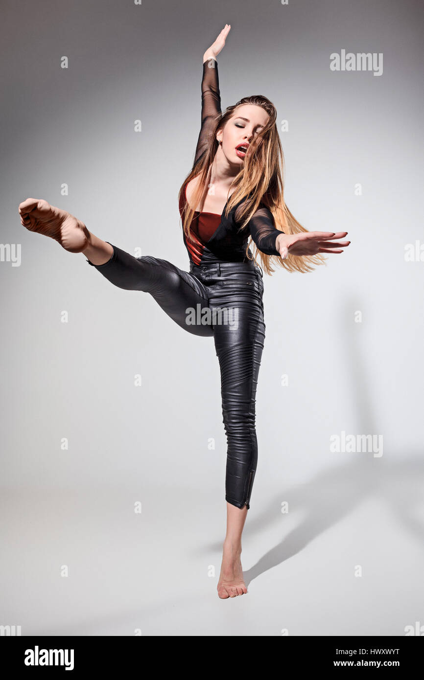 The woman dancing on gray Stock Photo - Alamy