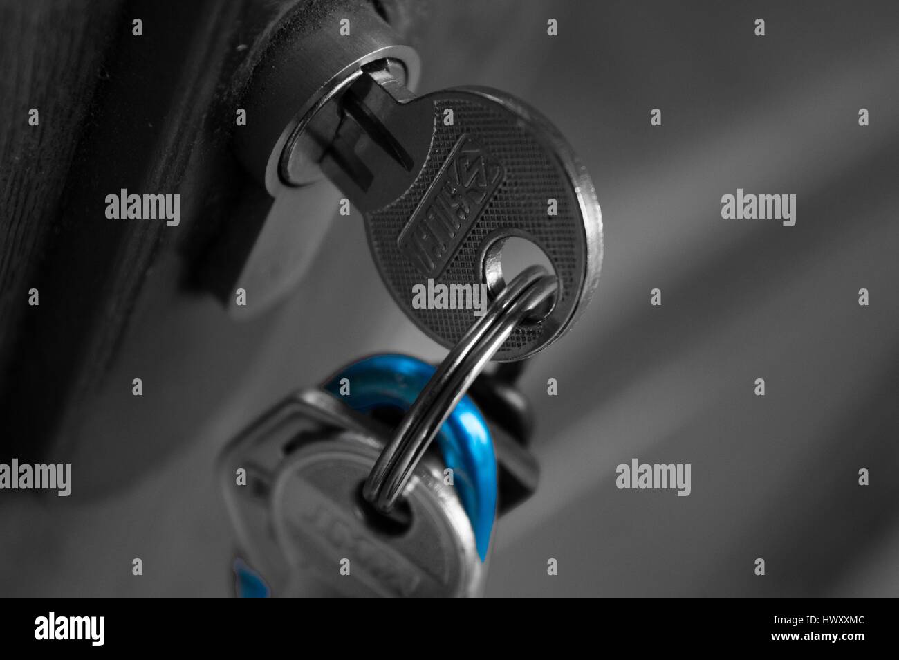 Keys opening door Stock Photo - Alamy