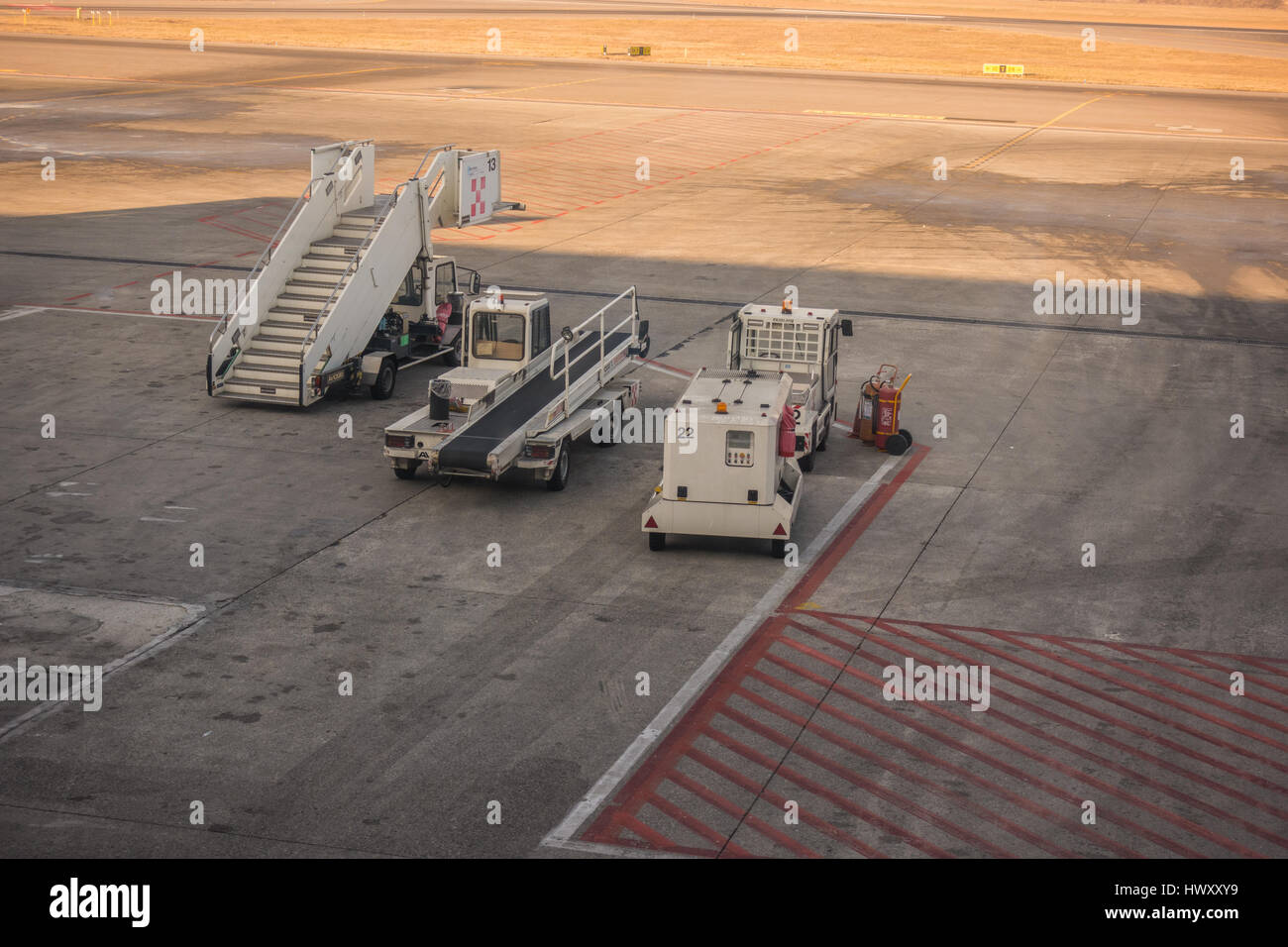 Service vehicles at the airport Stock Photo - Alamy