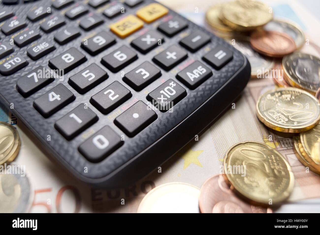 Scientific calculator and cash view Stock Photo - Alamy