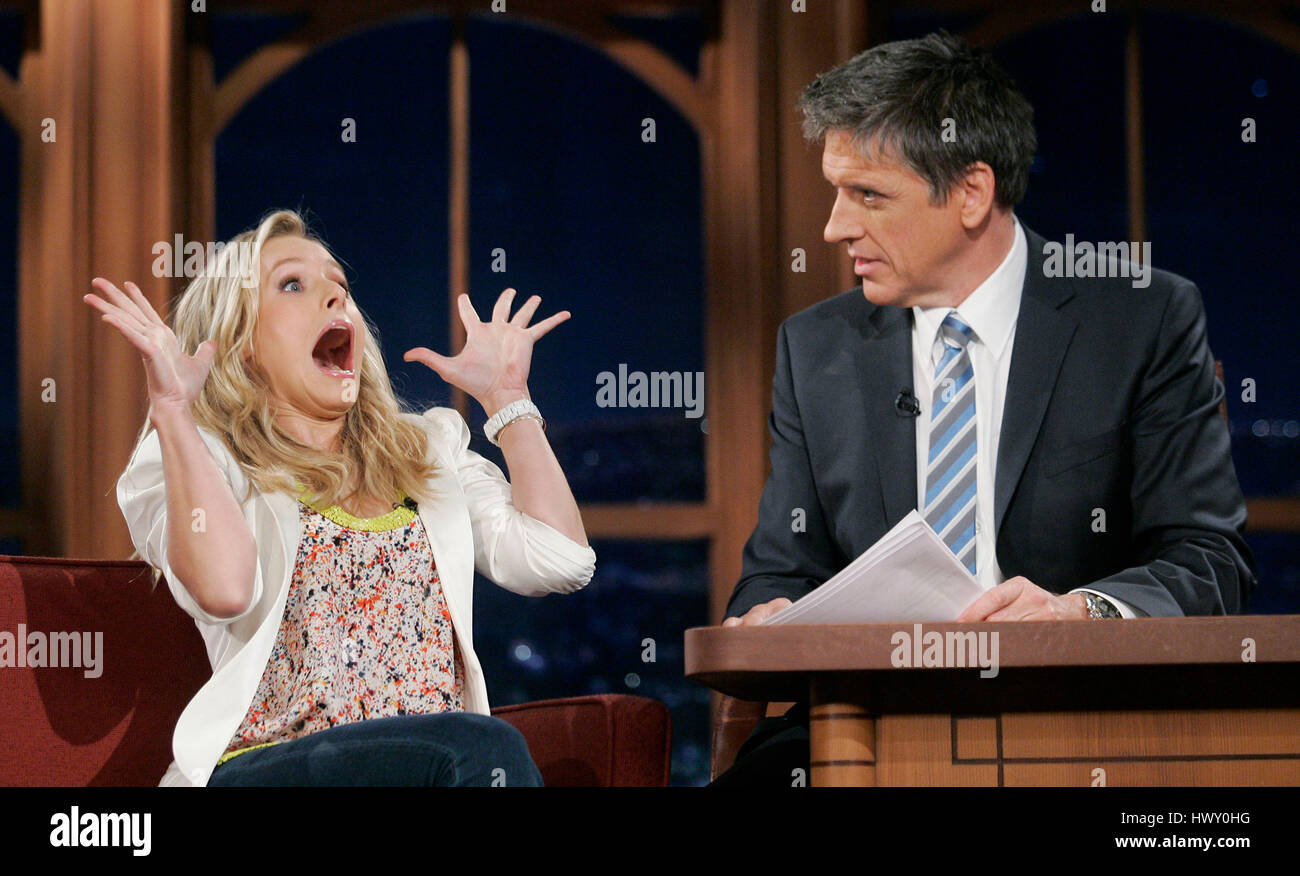 Actress Kristen Bell, left, feigns surprise while reading viewer emails ...