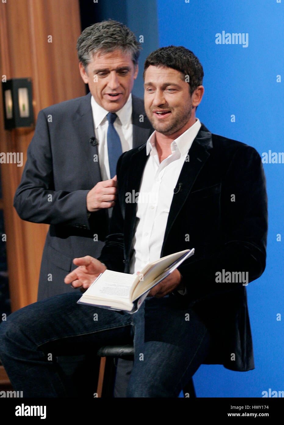 Actor Gerard Butler, right, reads an excerpt from Craig Ferguson's book ...