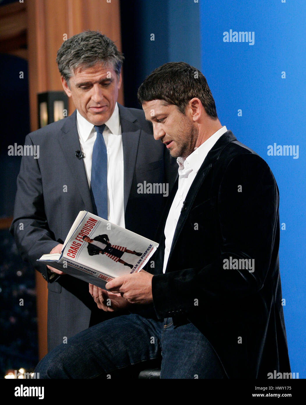 Actor Gerard Butler, right, reads an excerpt from Craig Ferguson's book ...
