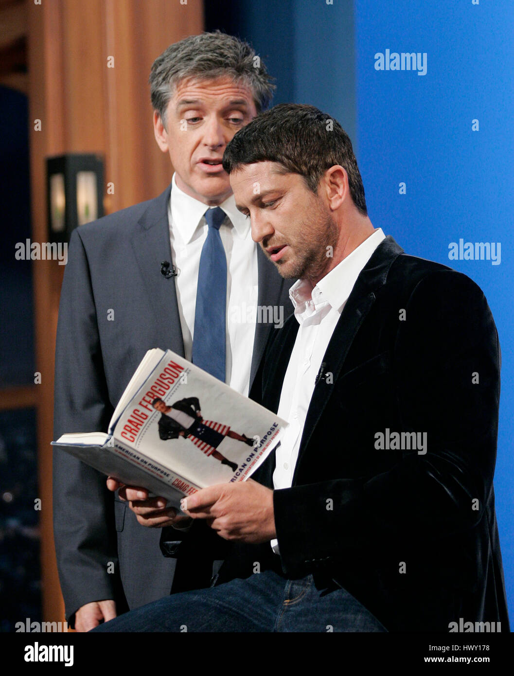 Actor Gerard Butler, right, reads an excerpt from Craig Ferguson's book ...