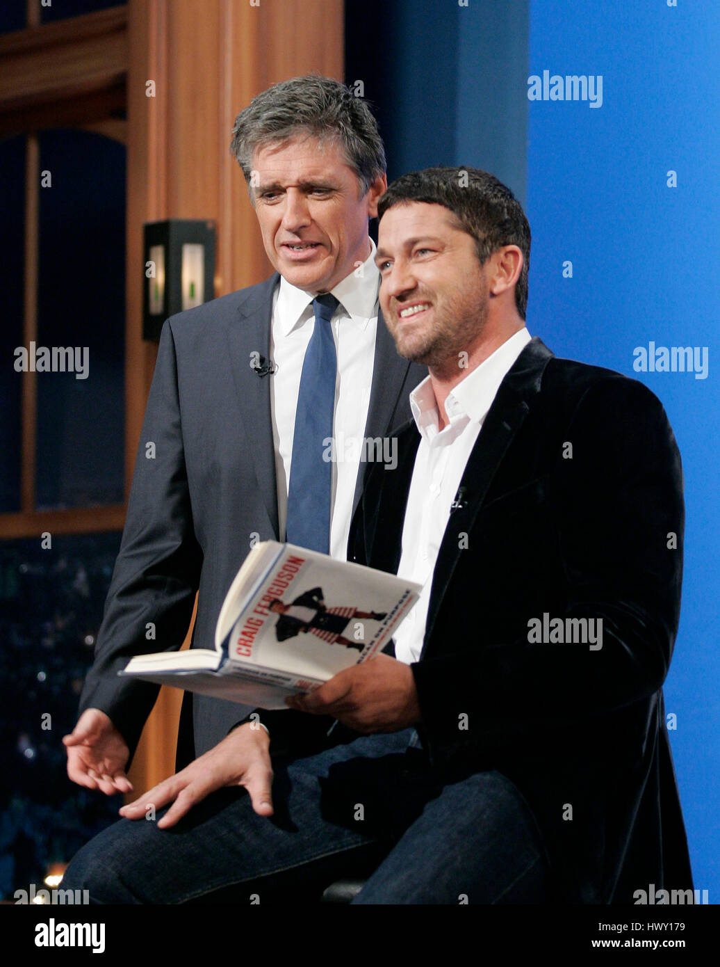 Actor Gerard Butler, right, reads an excerpt from Craig Ferguson's book ...