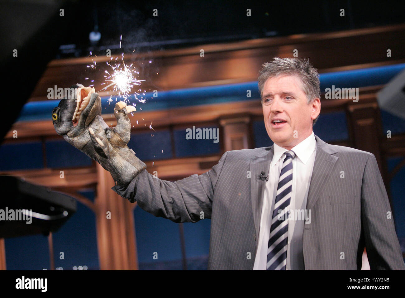 Host Craig Ferguson lights a sparkler during a segment of 'The Late ...