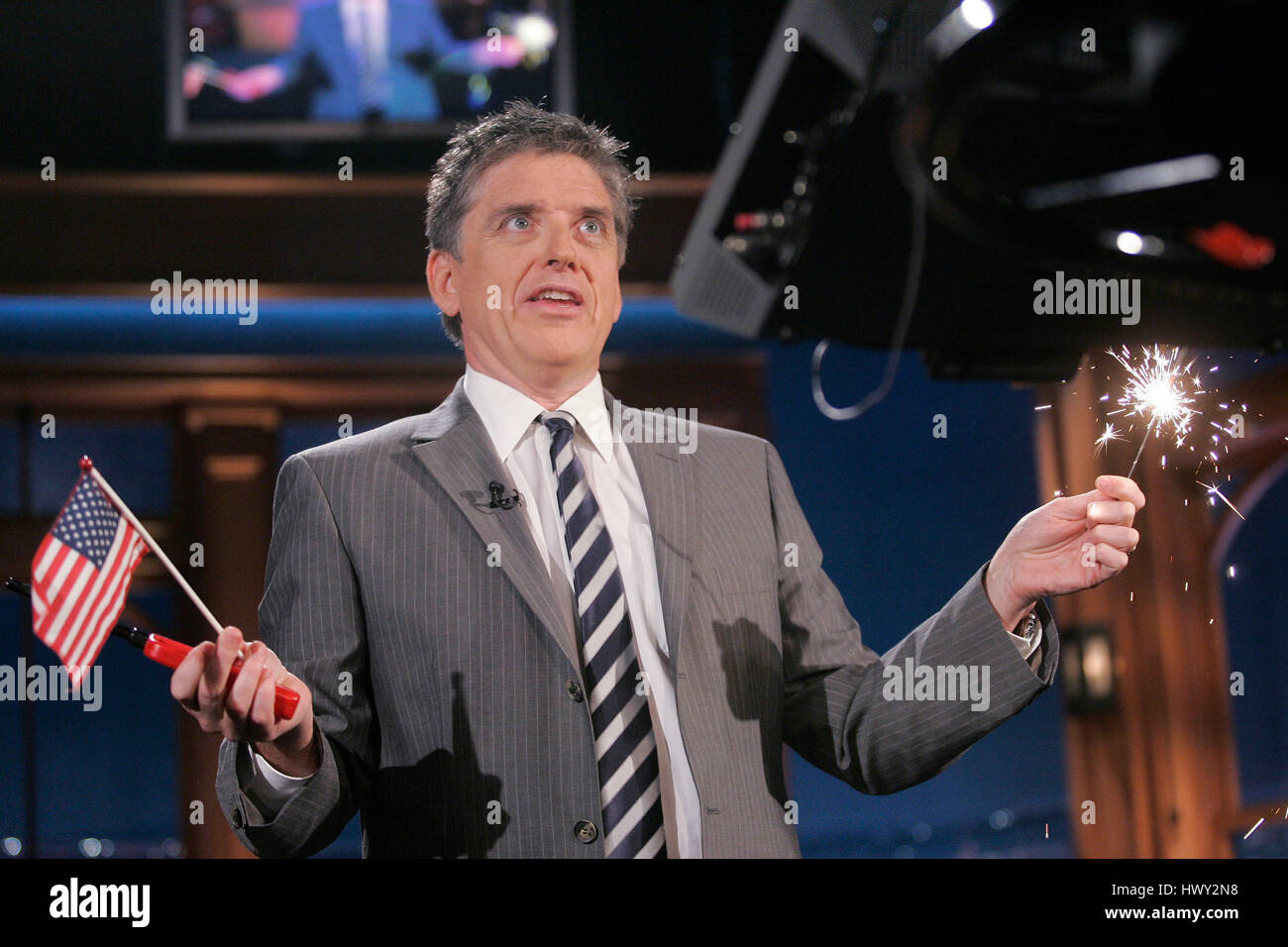 Host Craig Ferguson lights a sparkler during a segment of 'The Late ...