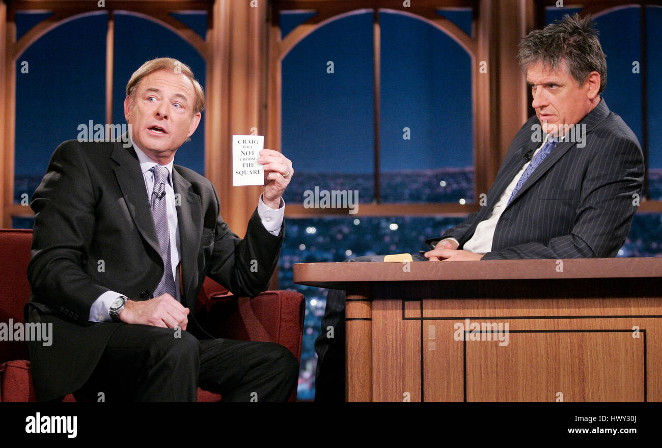 Magician Jason Randal, left, performs a trick with host Craig Ferguson ...